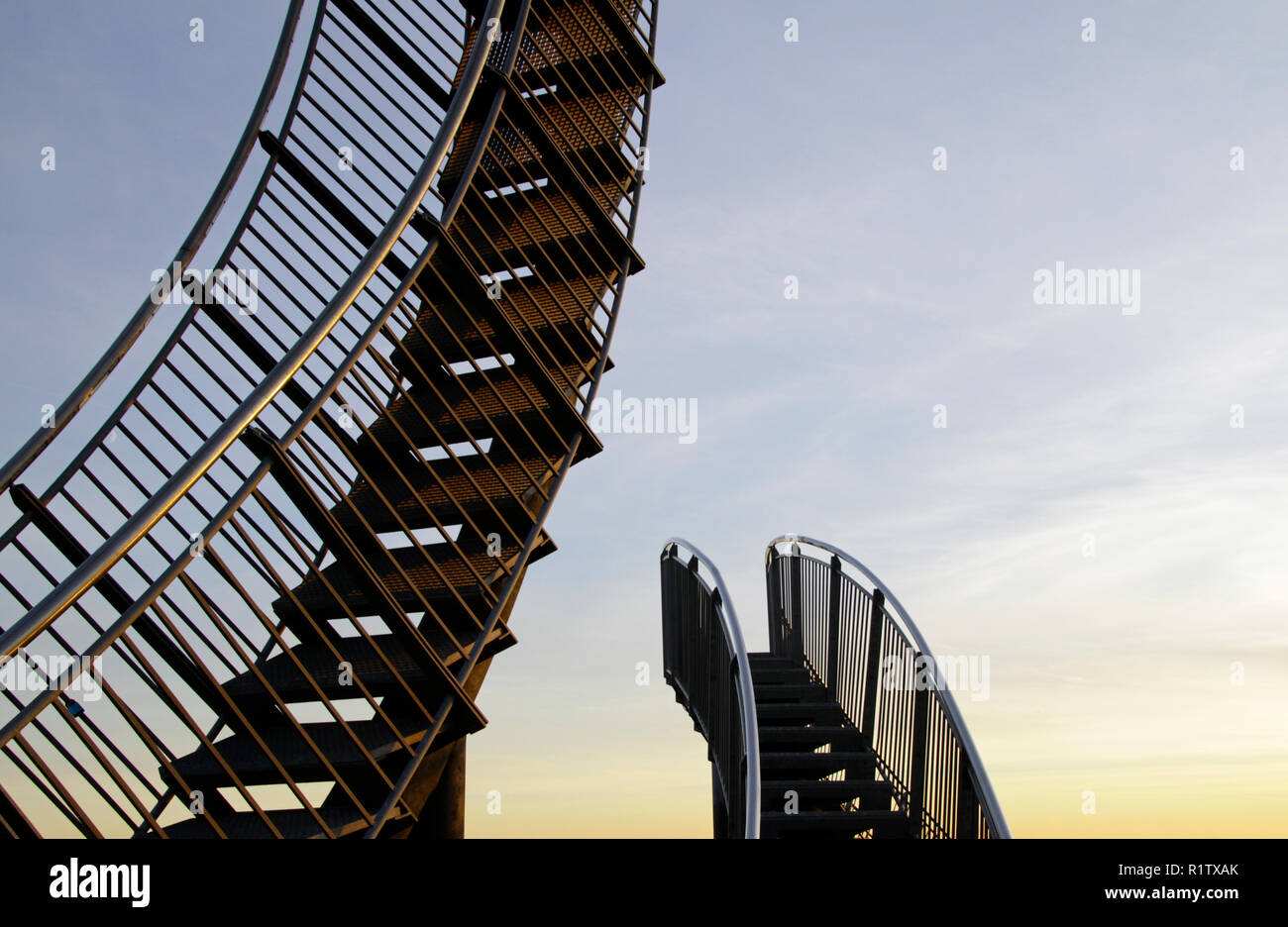Steep metal stairs during sunset Stock Photo - Alamy
