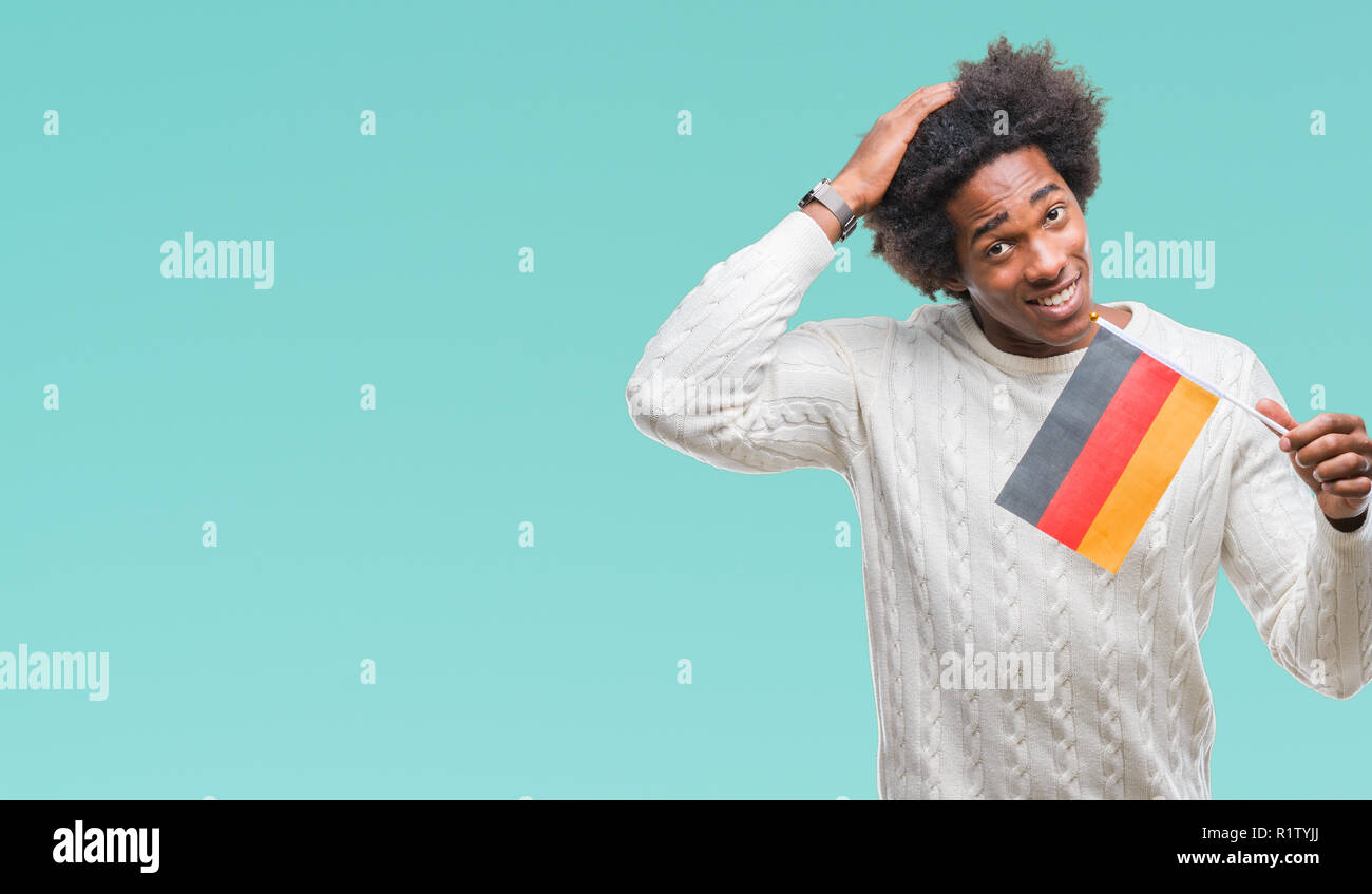 Afro american man flag of Germany over isolated background stressed ...