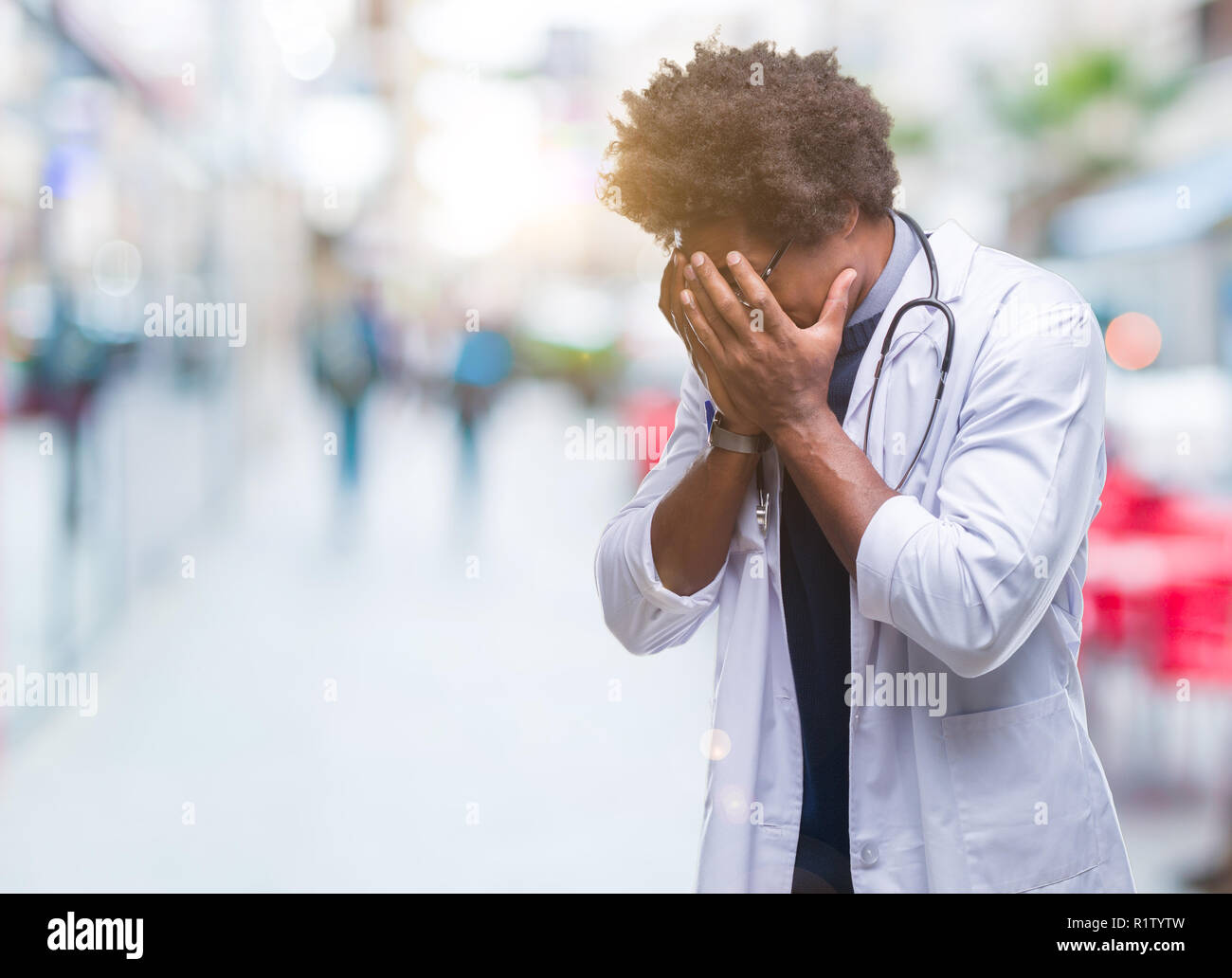 Afro american doctor man over isolated background with sad expression ...