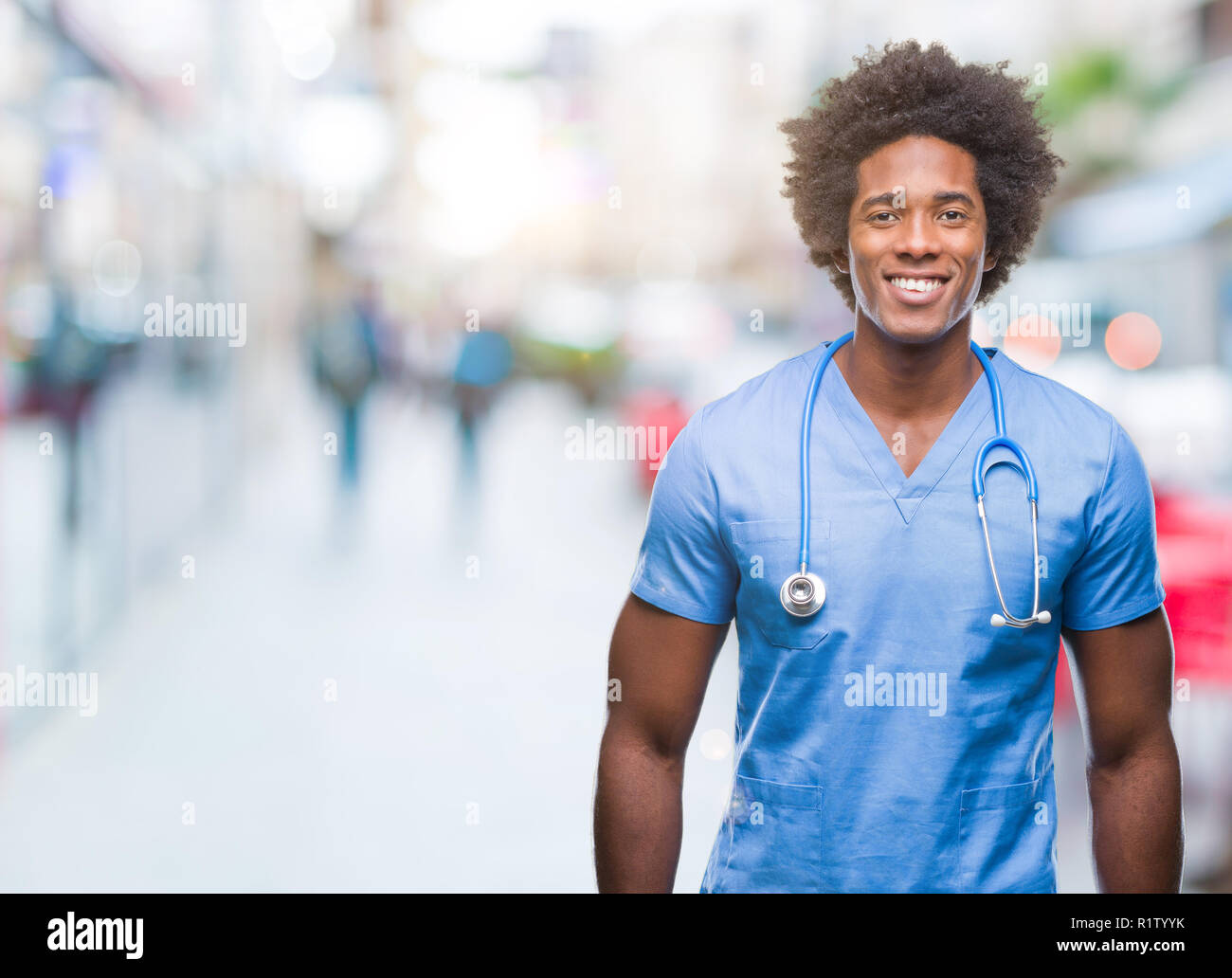 Afro american surgeon doctor man over isolated background with a happy ...