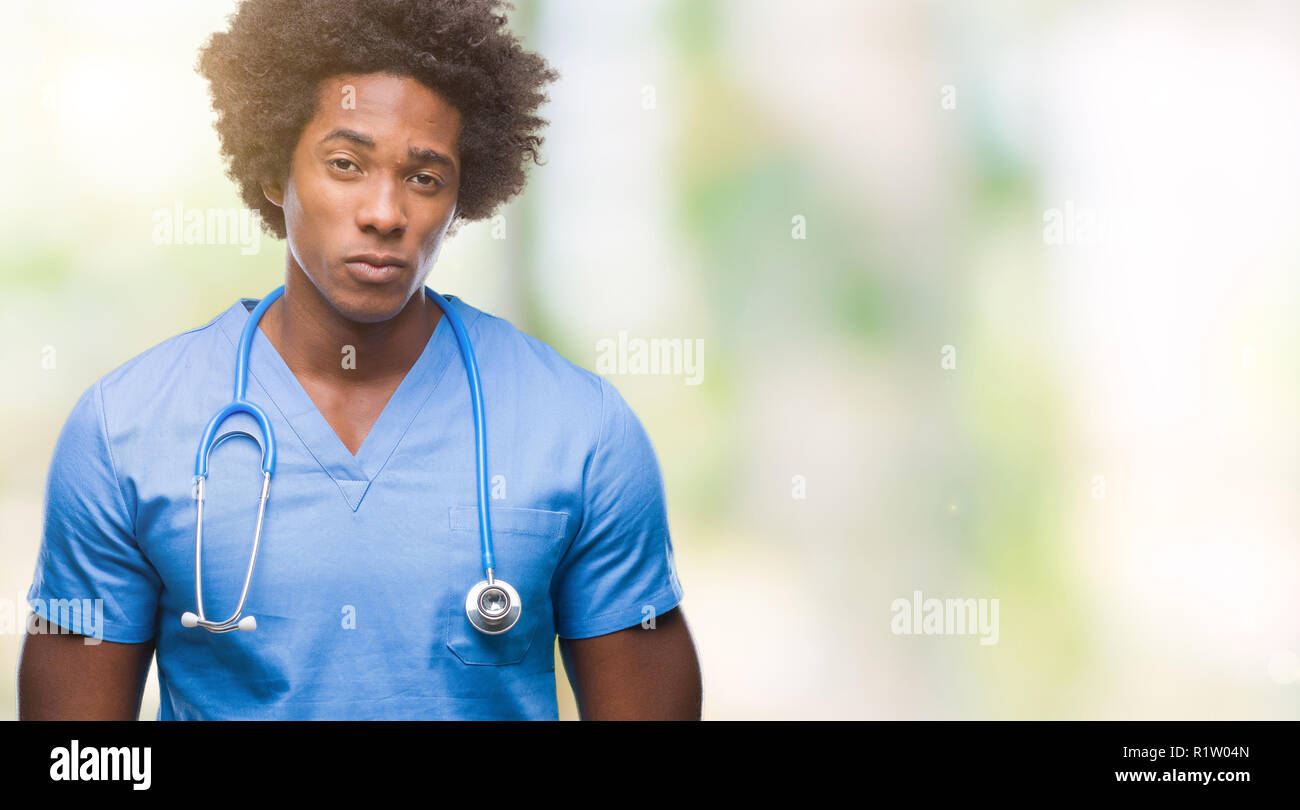 Afro american surgeon doctor man over isolated background skeptic and ...