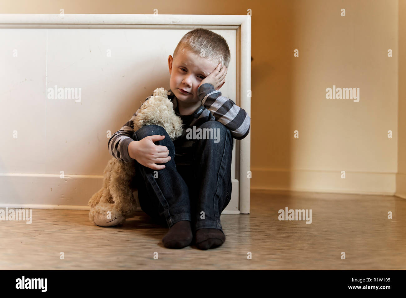 Boy child crying stairs alone hi-res stock photography and images - Alamy