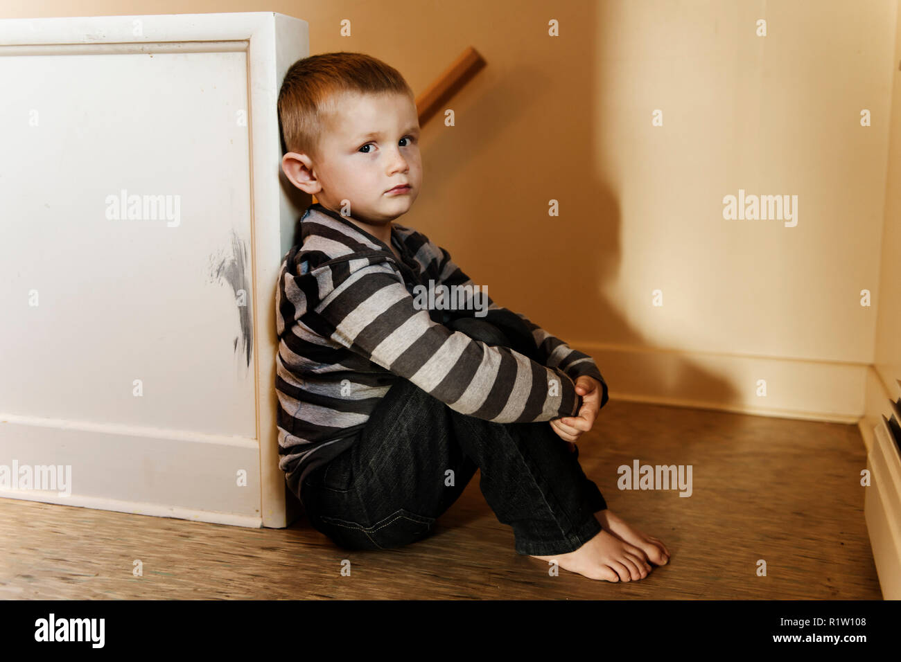 Upset problem child close to the staircase concept for bullying ...