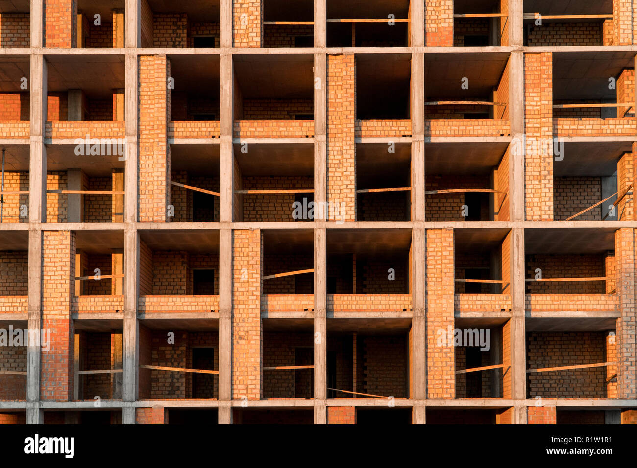 Fragment of a brick building on construction site. Modern metropolis ...