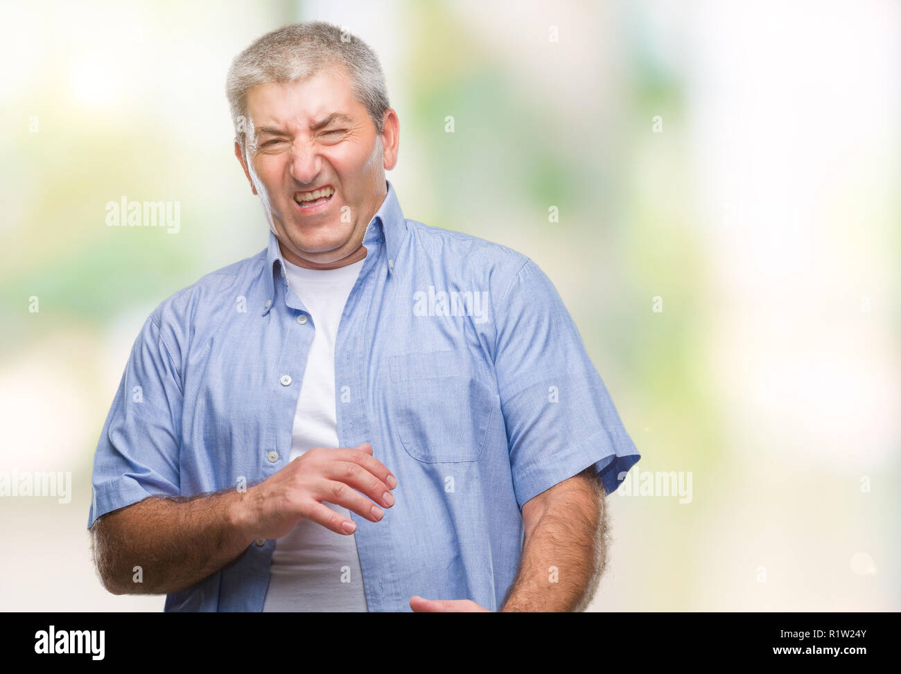 Handsome senior man over isolated background disgusted expression ...