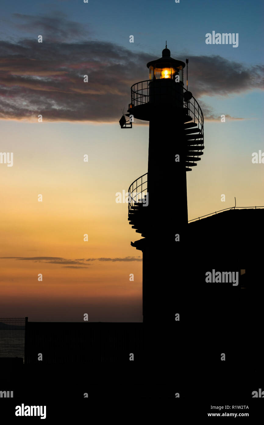 Silhouette of the lighthouse of Zadar, Croatia against the evening sky ...