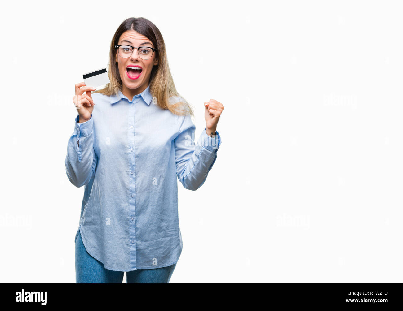 Young beautiful business woman holding credit card over isolated ...