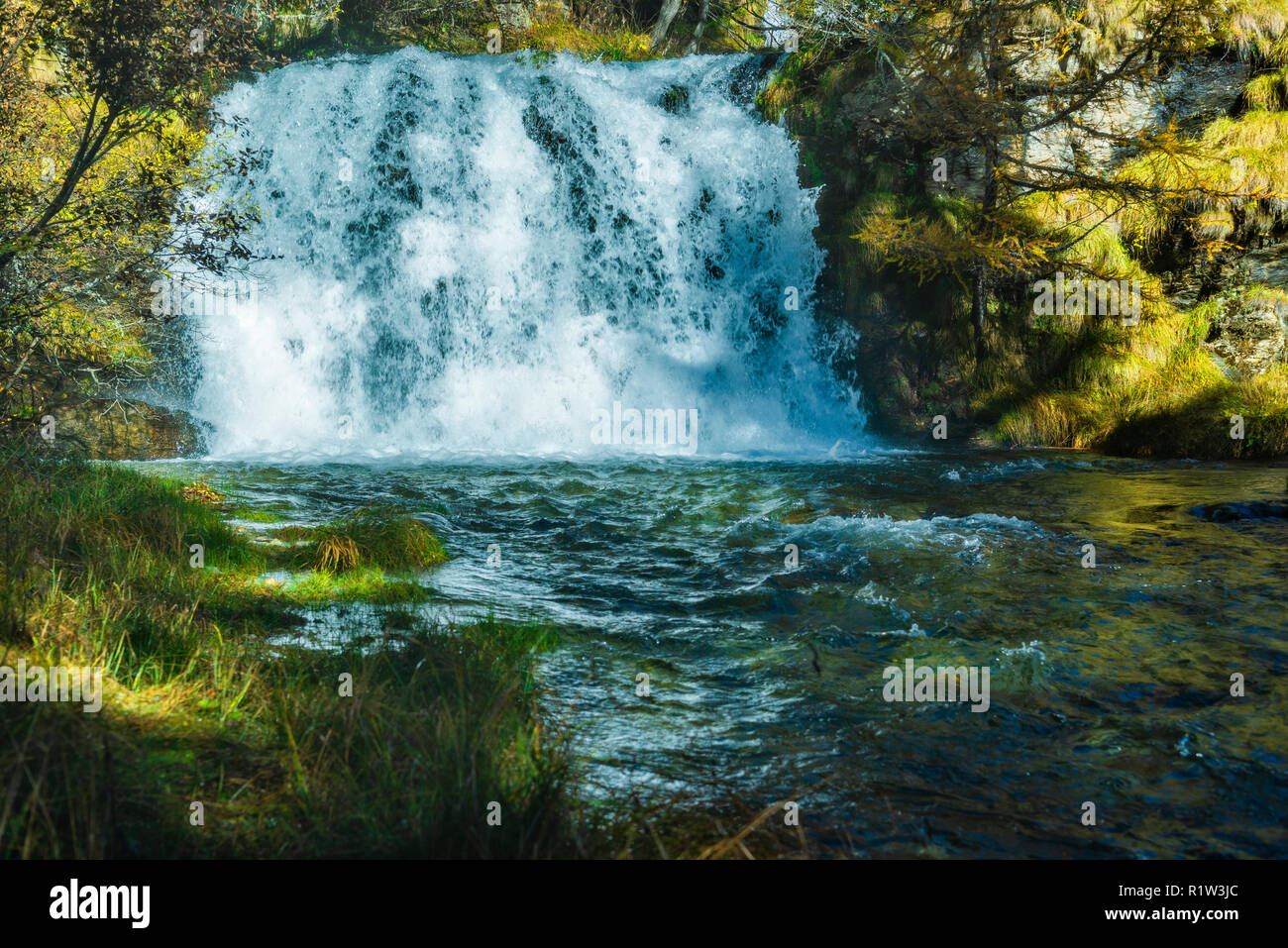 a small river waterfall at the entrance of Alpe Devero park Stock Photo ...