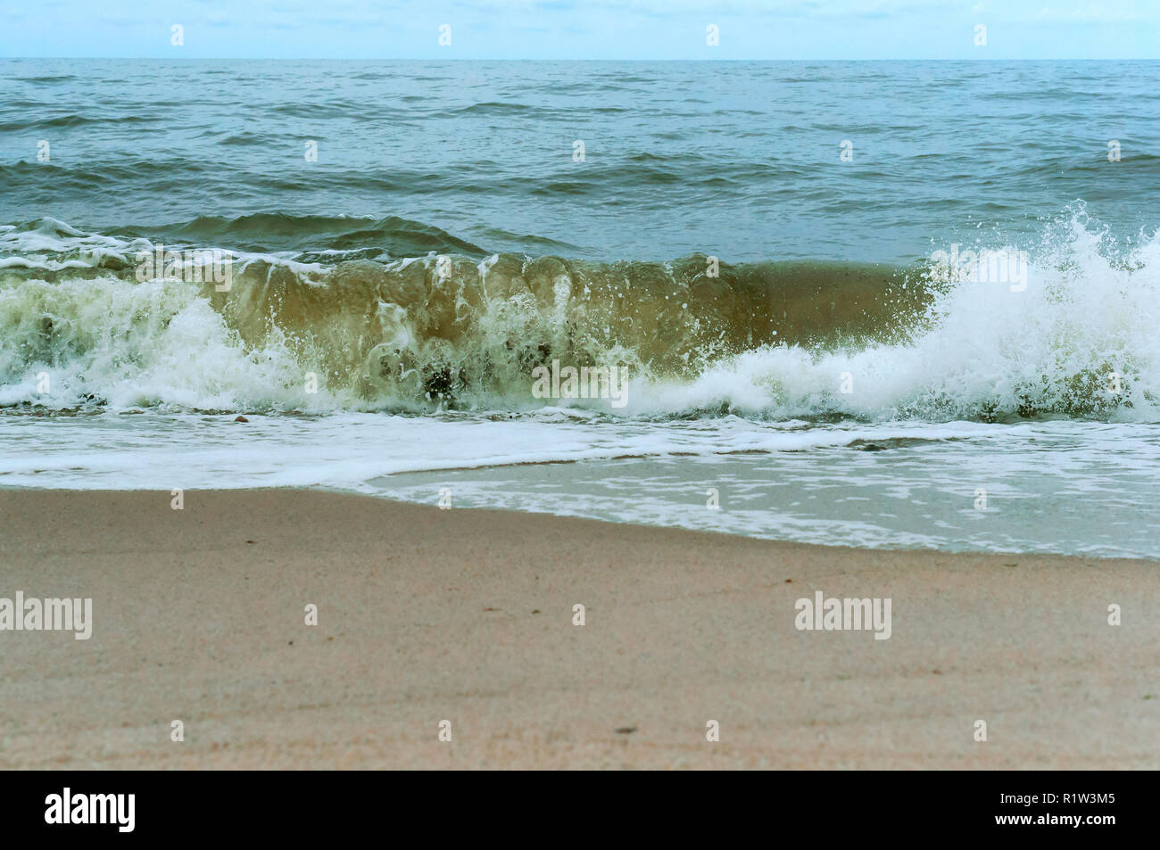 green sea wave, small wave with white foam Stock Photo - Alamy