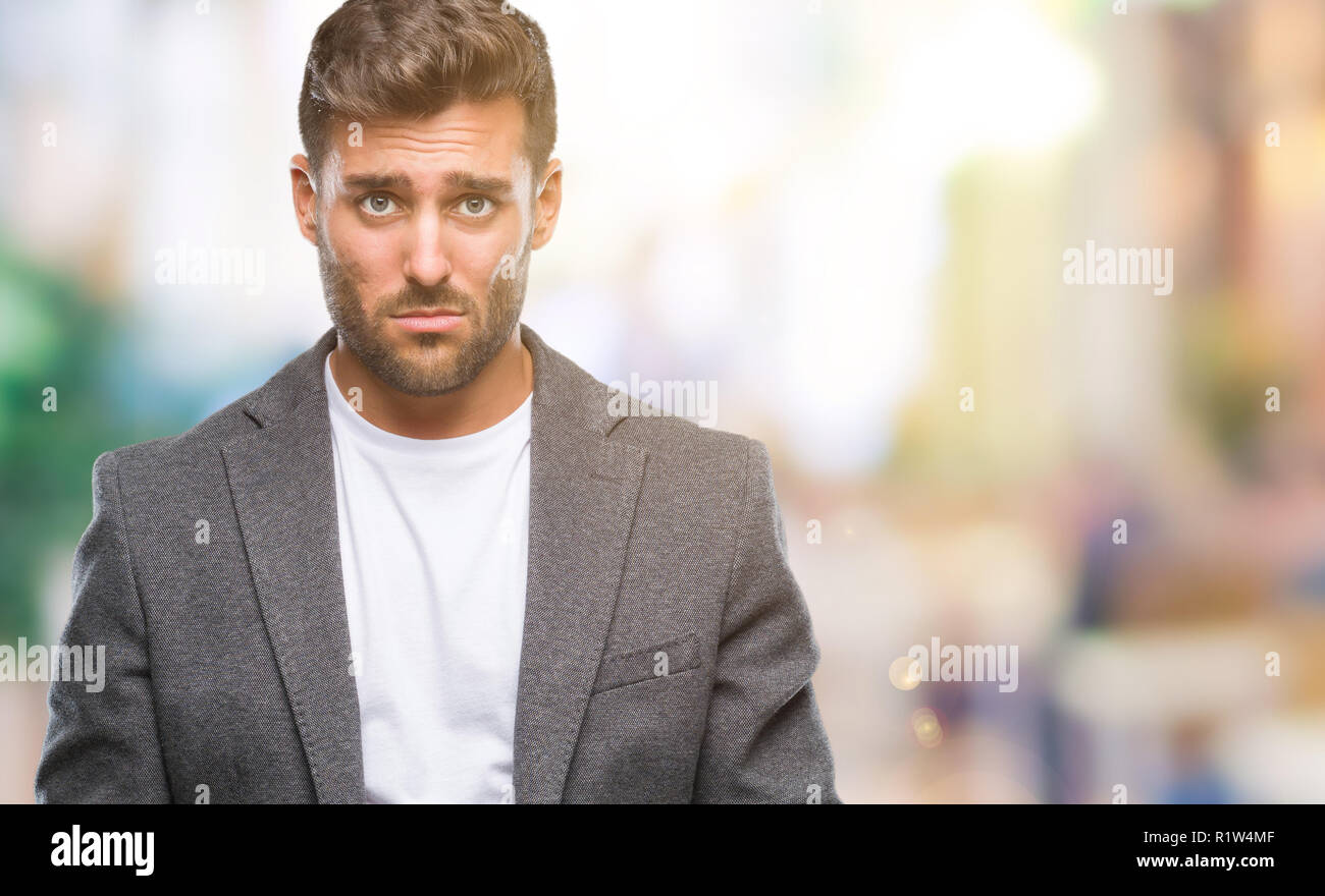 Young handsome business man over isolated background depressed and ...