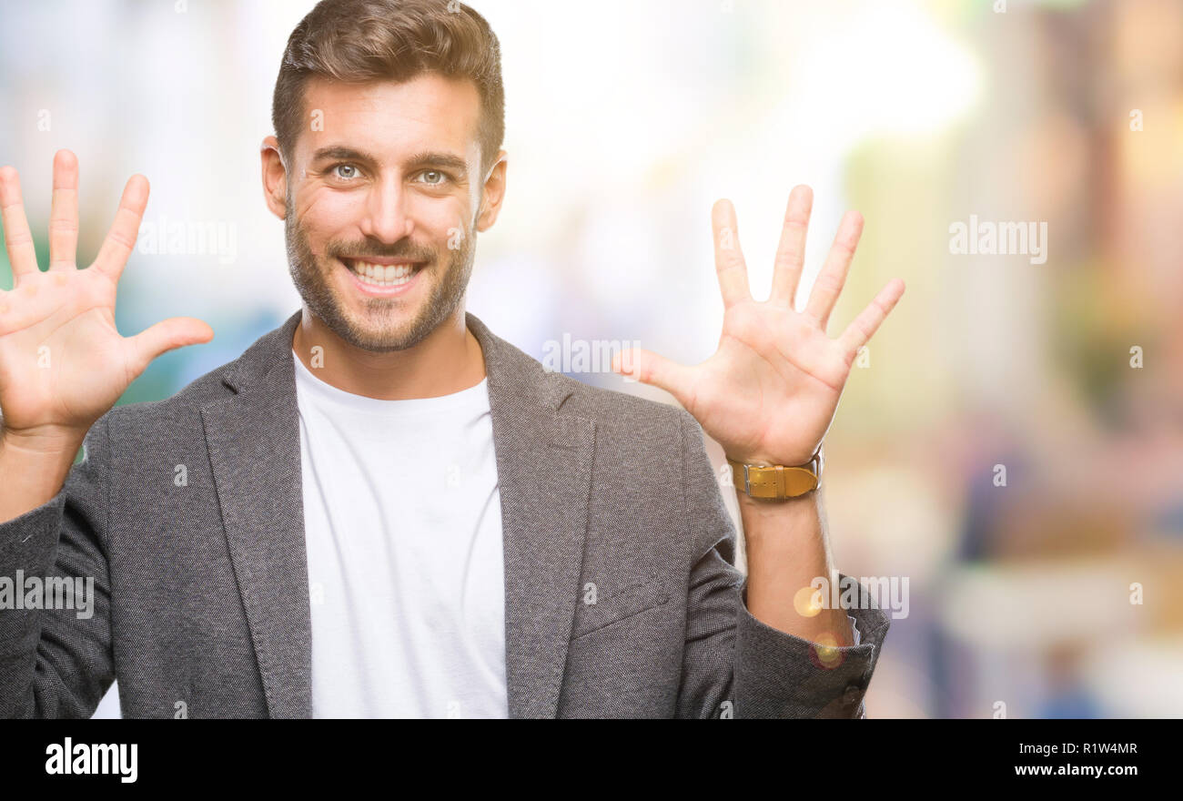 Young handsome business man over isolated background showing and ...