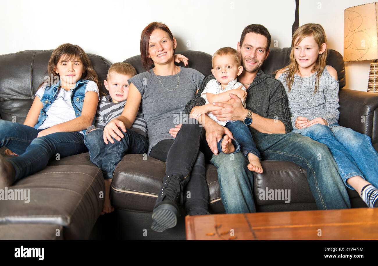 A Portrait of family having fun in the living room. Happy family ...