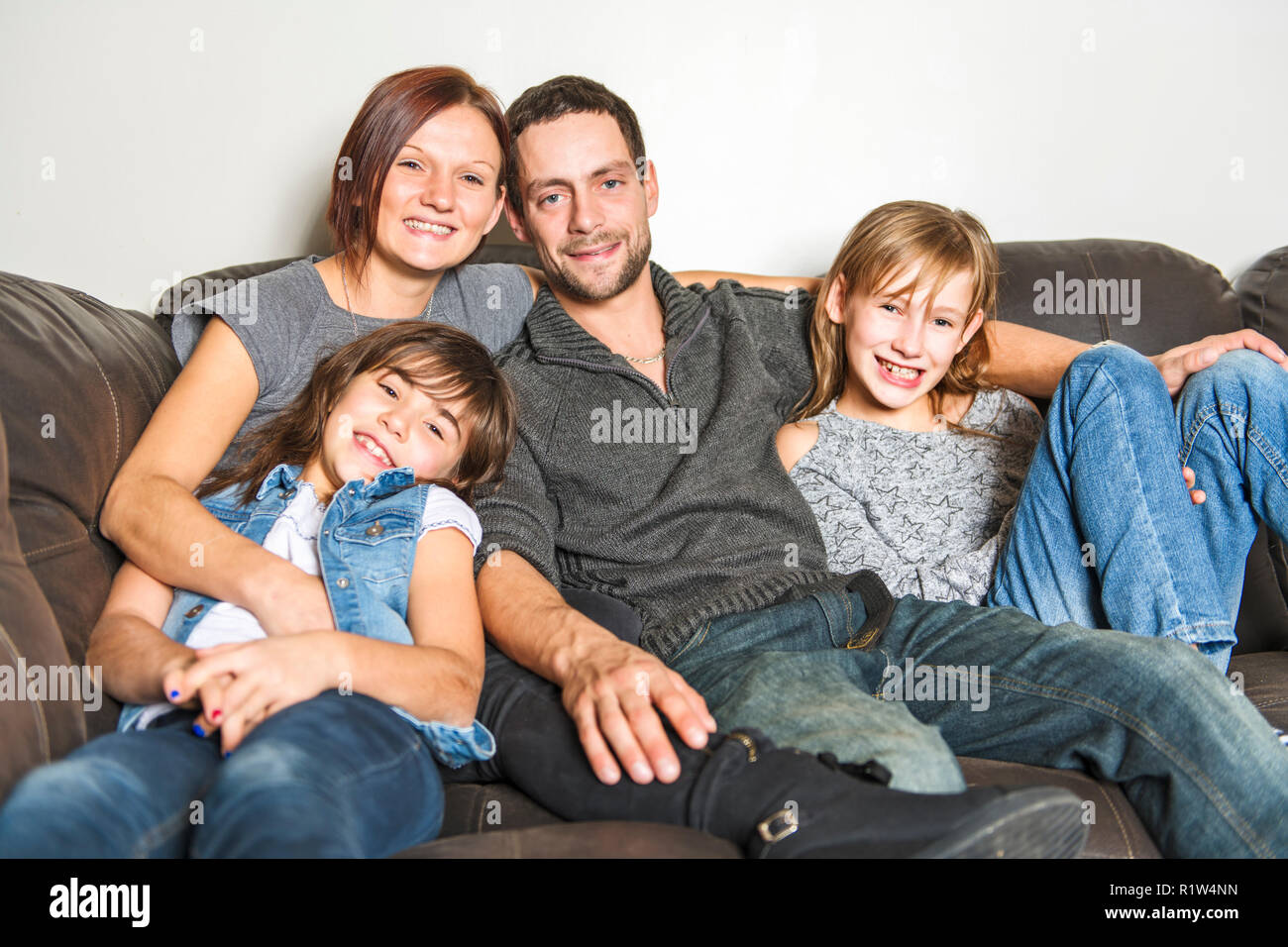 A Portrait of family having fun in the living room. Happy family ...