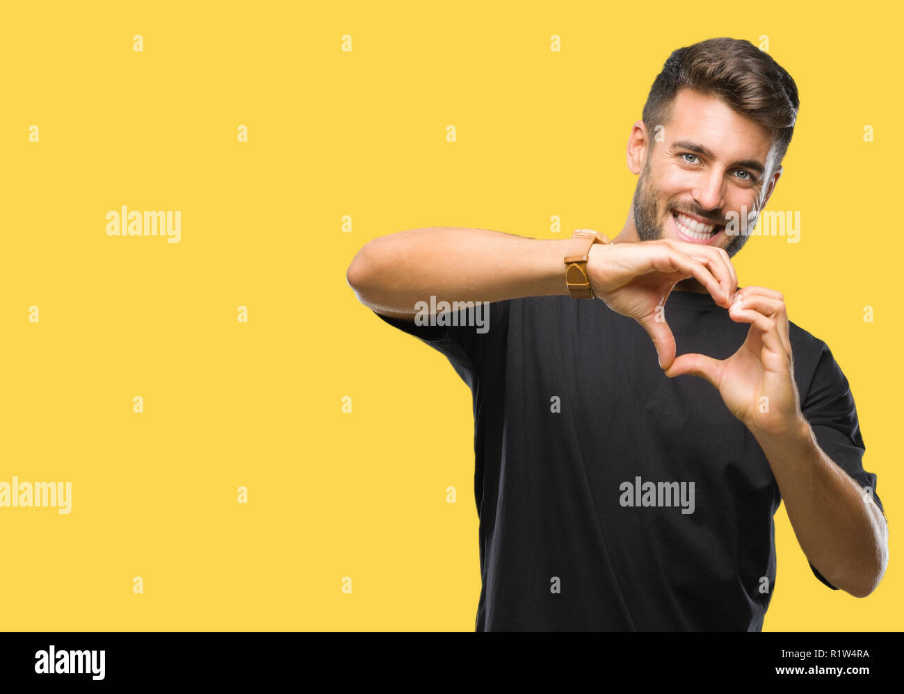 Young handsome man over isolated background smiling in love showing ...