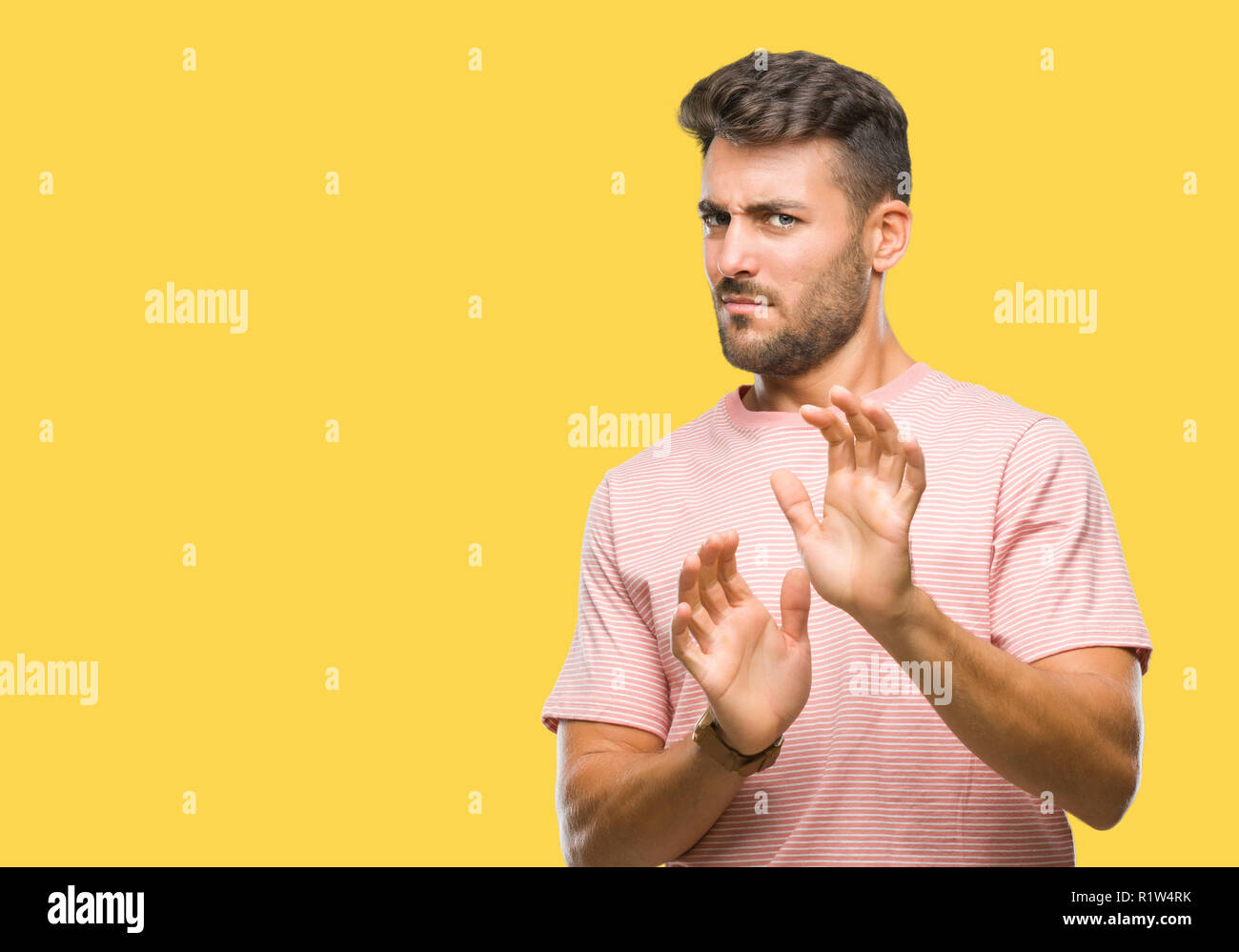 Young handsome man over isolated background disgusted expression ...