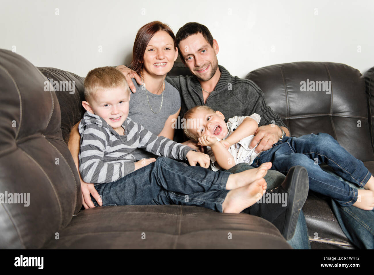 A Portrait of family having fun in the living room. Happy family ...