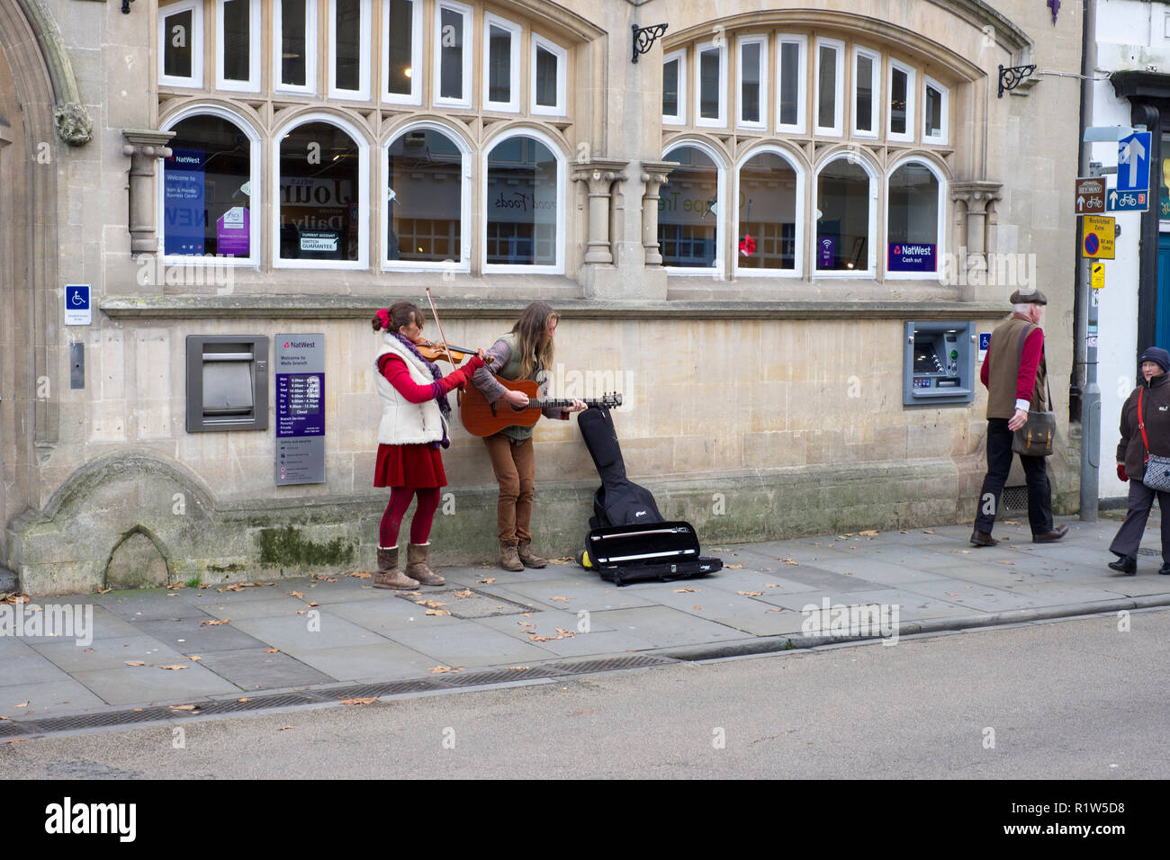 Woman playing guitar singing busking hi-res stock photography and ...