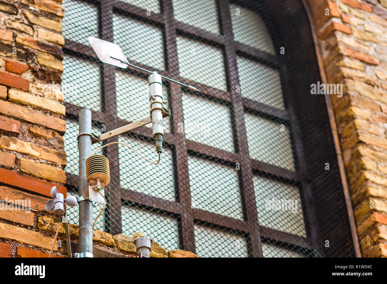 Anemometer on the wall of an ancient church Stock Photo - Alamy