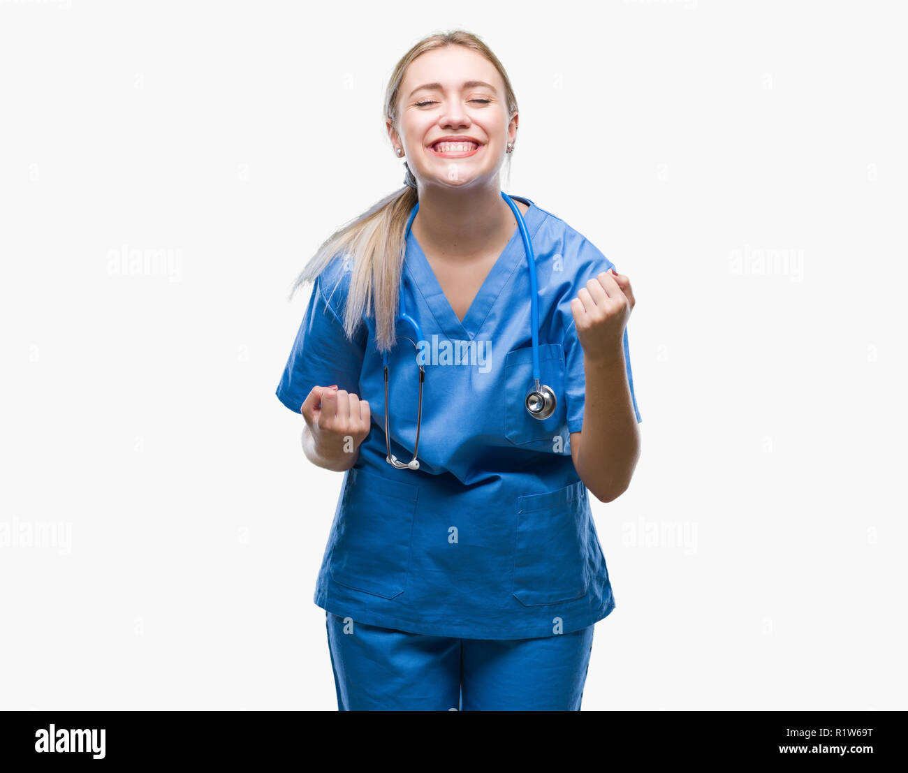 Young blonde surgeon doctor woman over isolated background very happy ...