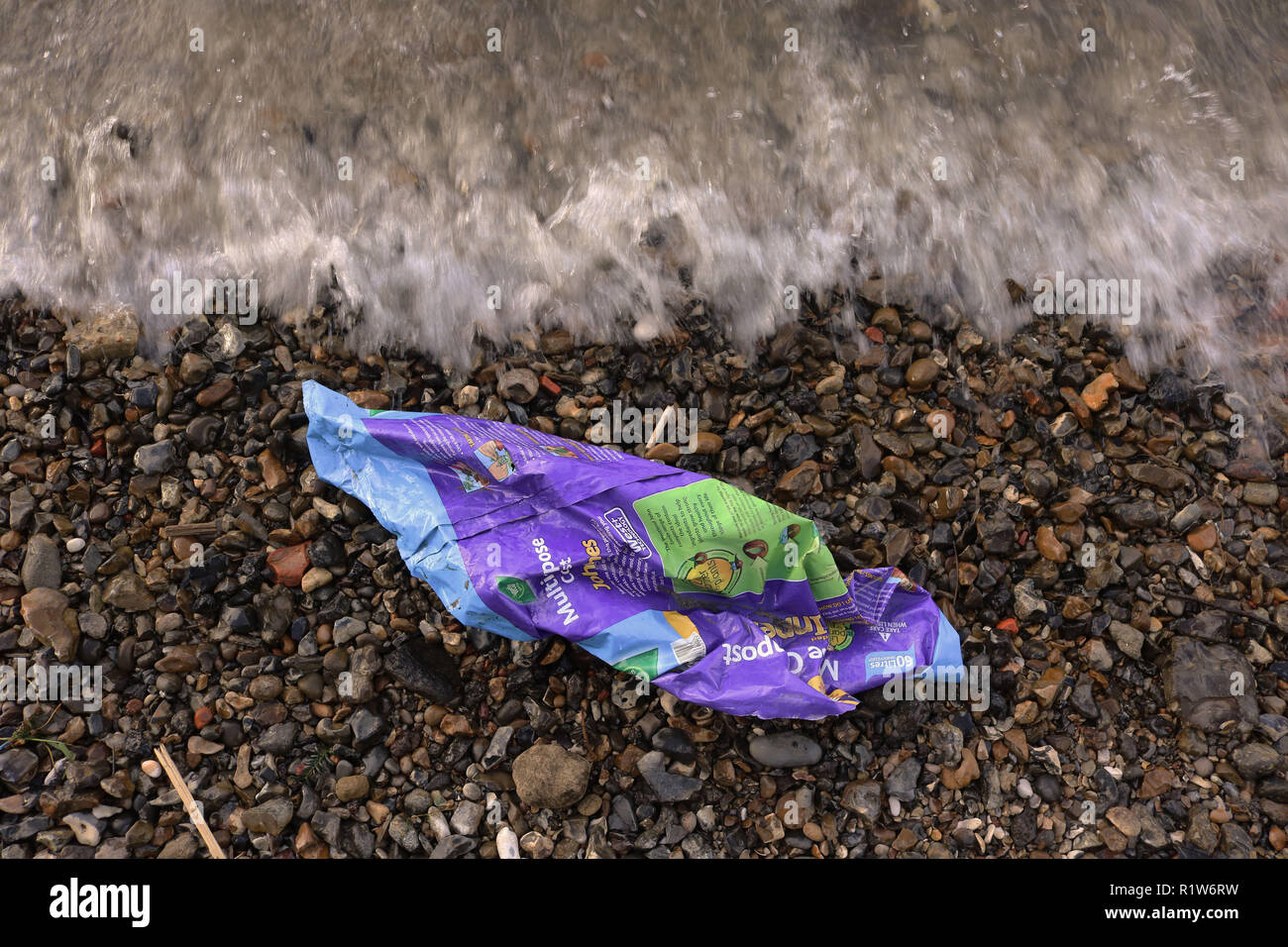 Compost Plastic bag washed up on the shoreline of the River Thames in ...