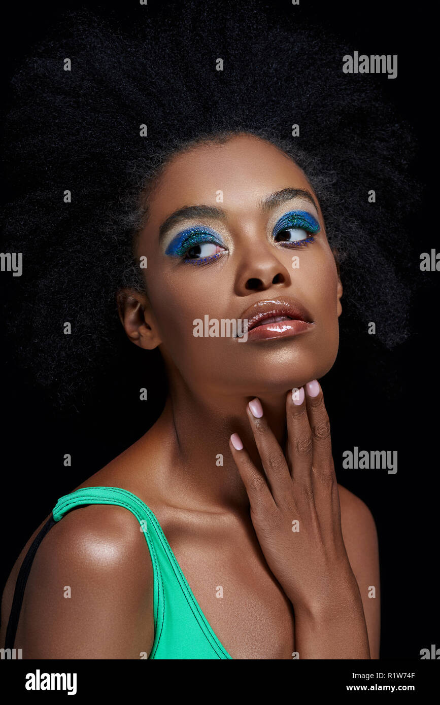 portrait of pensive african american model with bright blue eyes ...