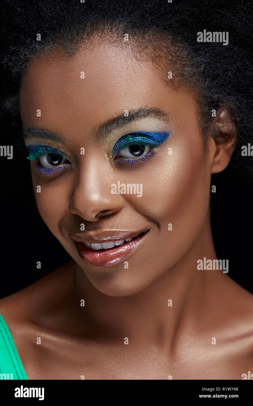 portrait of beautiful african american model with bright blue eyes ...