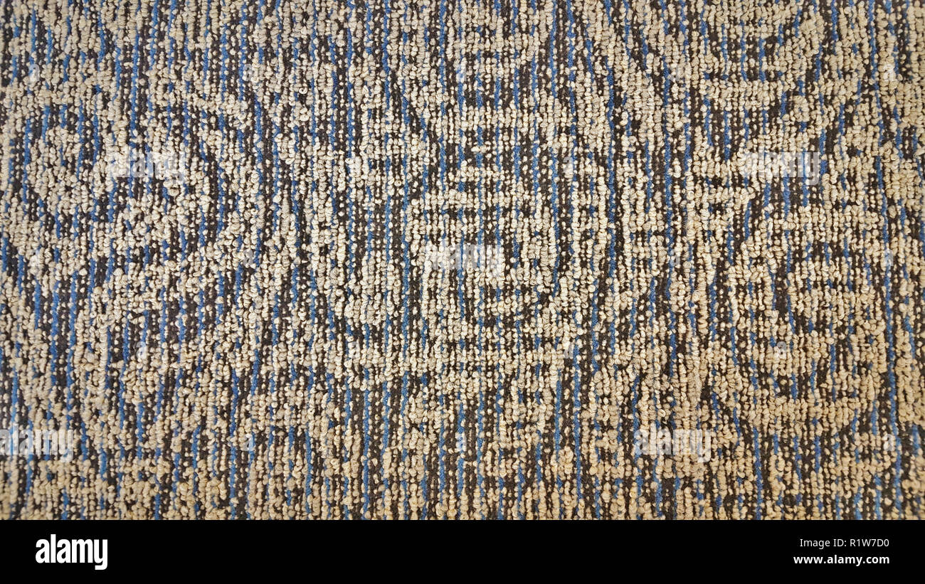 Section of thin carpet with blue swirl patterns and designs Stock Photo ...