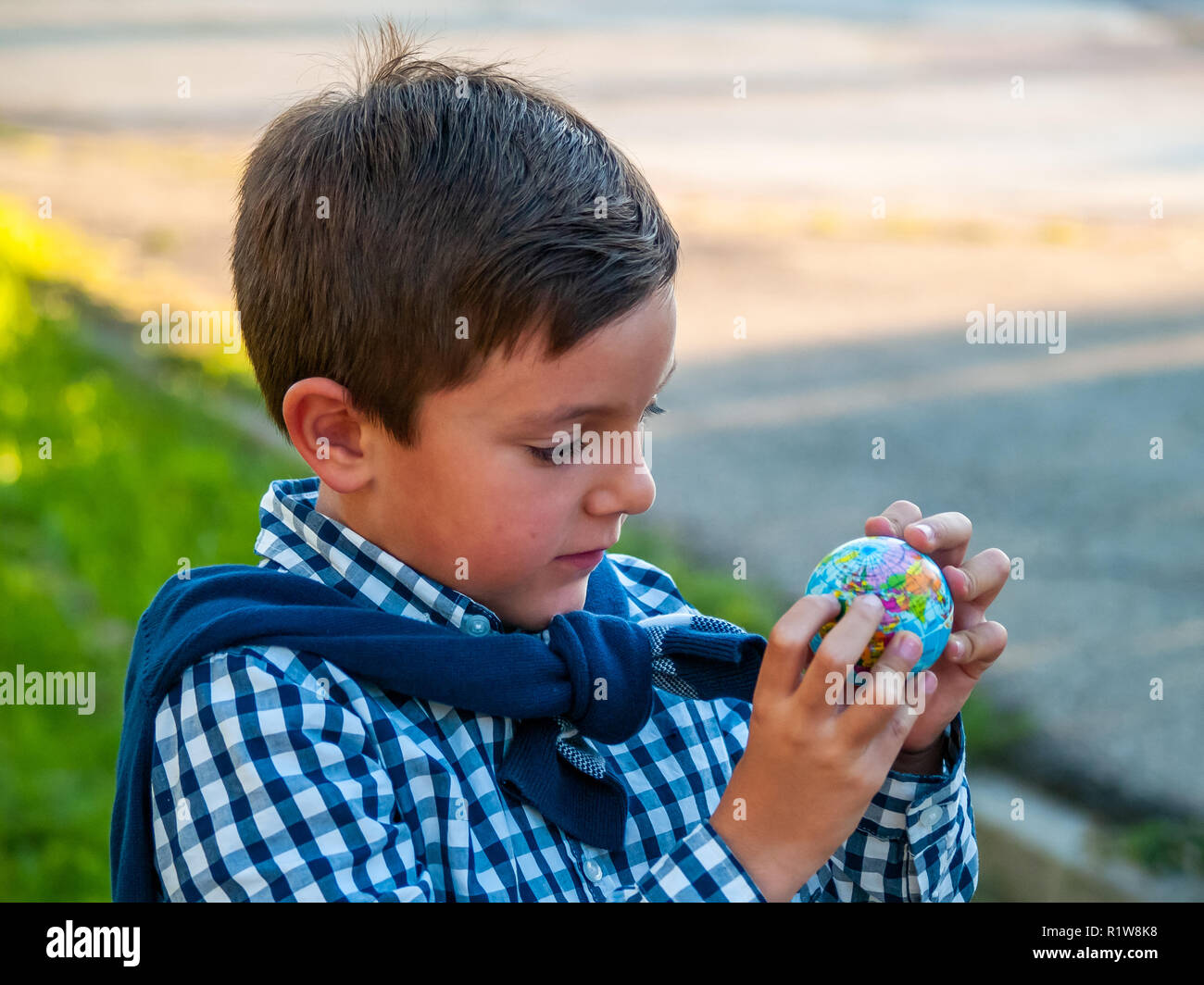 Child protect earth hi-res stock photography and images - Alamy