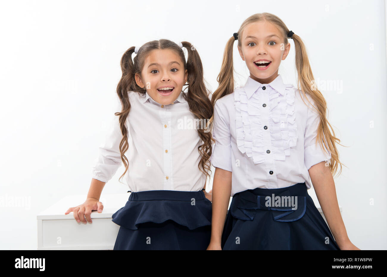 Back to school is here. Little girls happy to be back to school. happy ...