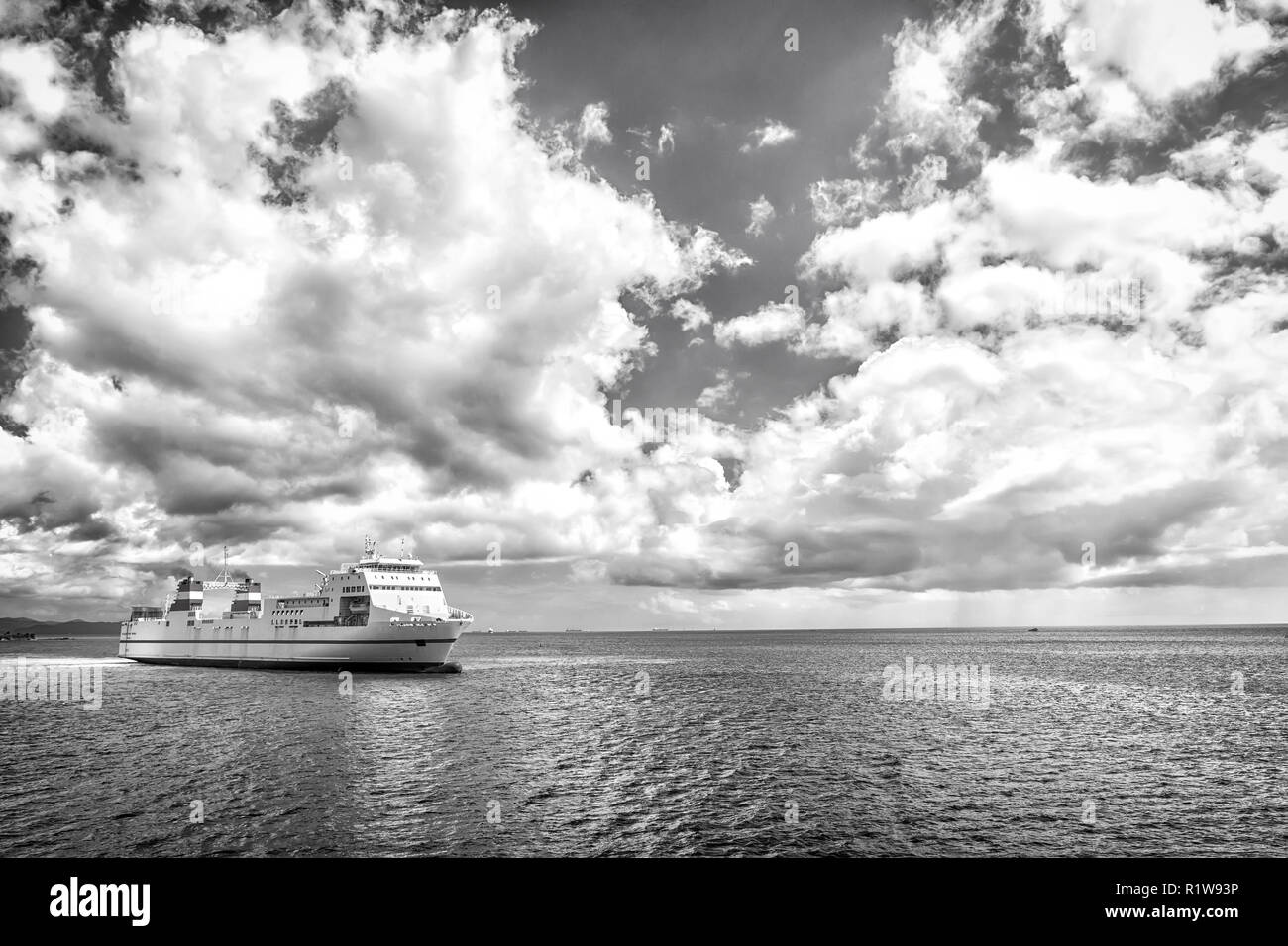 Ship in sea on cloudy blue sky. Seascape with ocean liner and clouds ...