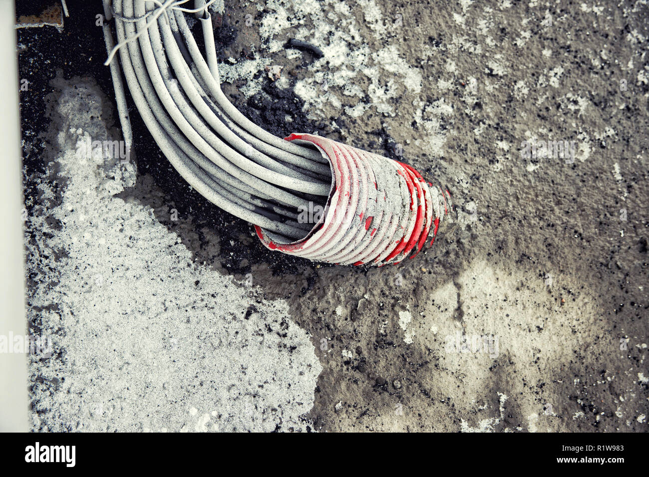 a large set of wires out of the hole in the pipe Stock Photo - Alamy
