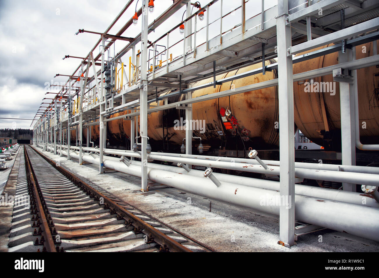 steel structure at the railroad at the tank farm Stock Photo - Alamy
