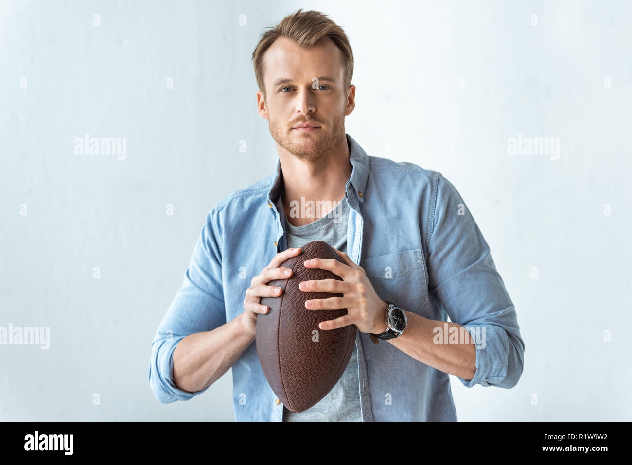 Man holding rugby ball hi-res stock photography and images - Alamy
