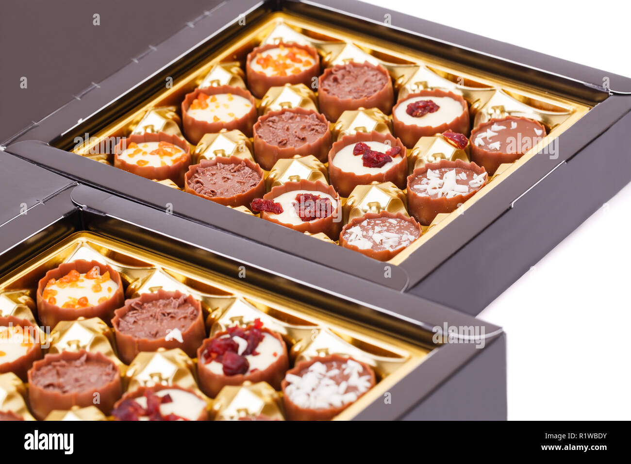 Assortment of chocolate in plastic boxes closeup picture Stock Photo ...