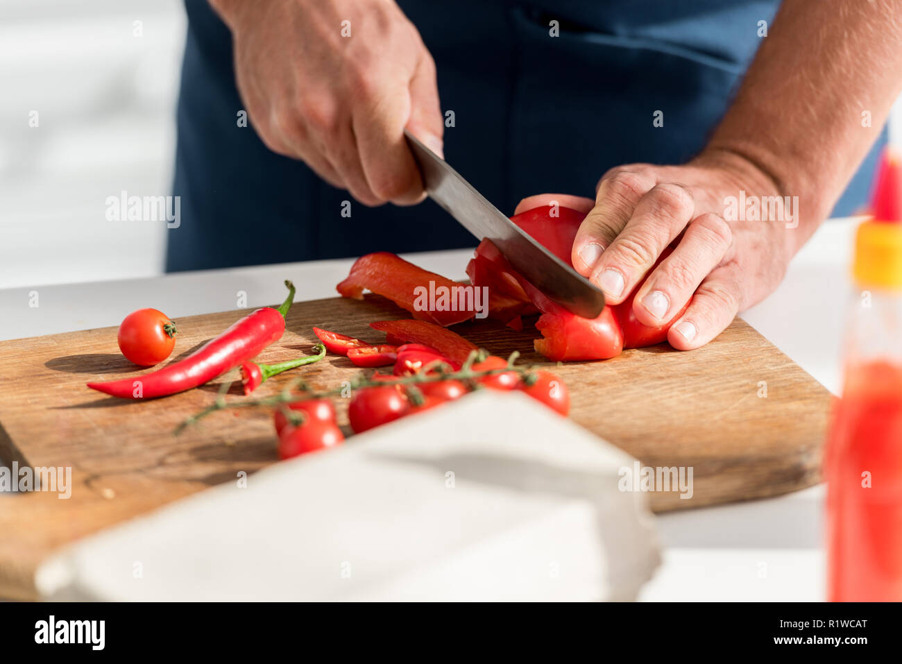 Person cutting vegetables red peppers hi-res stock photography and ...