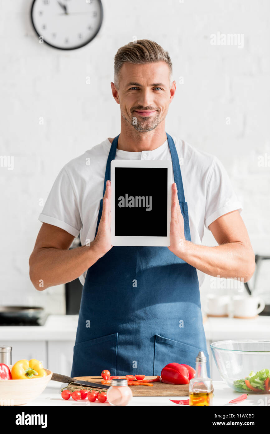adult man holding digital tablet with blank screen at kitchen Stock ...