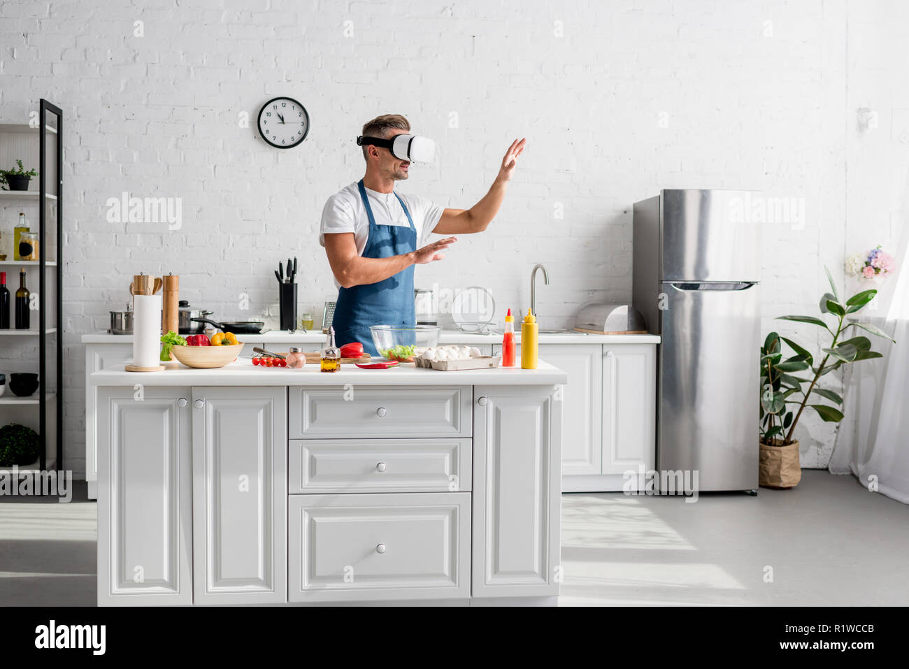 Headset cooking vegetables in kitchen hi-res stock photography and ...