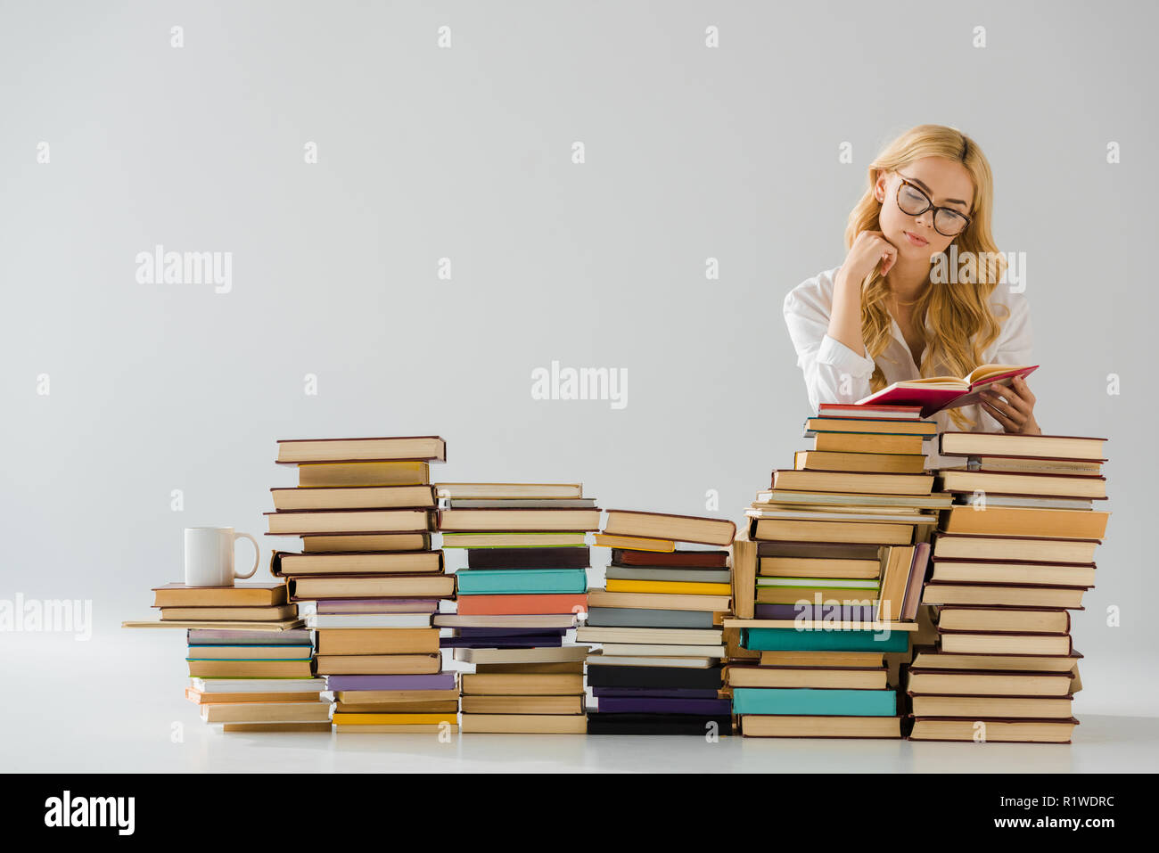 Books in pile glasses hi-res stock photography and images - Alamy