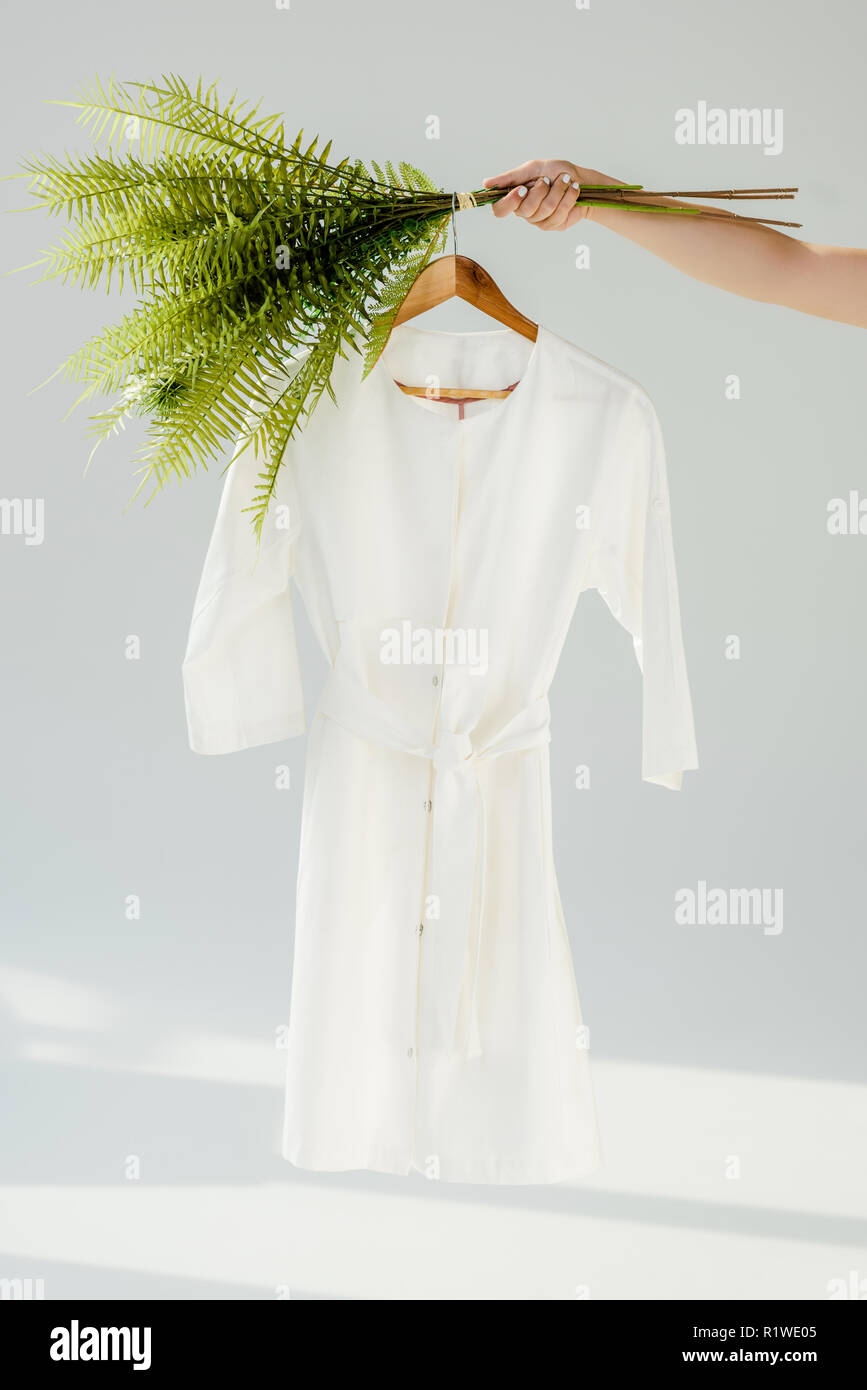 Hand holding hanger hi-res stock photography and images - Alamy