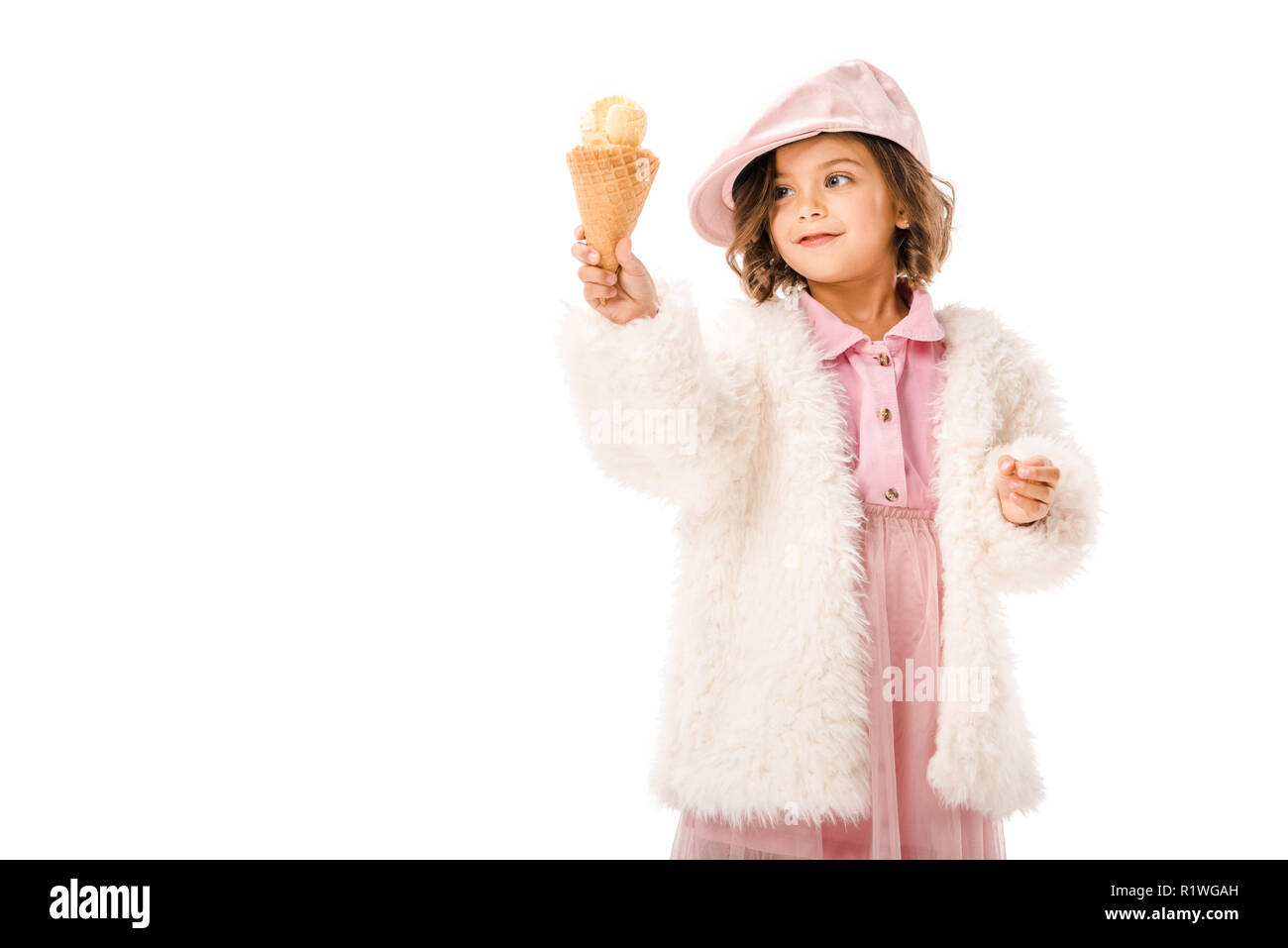 beautiful happy child in fur coat with ice cream isolated on white ...