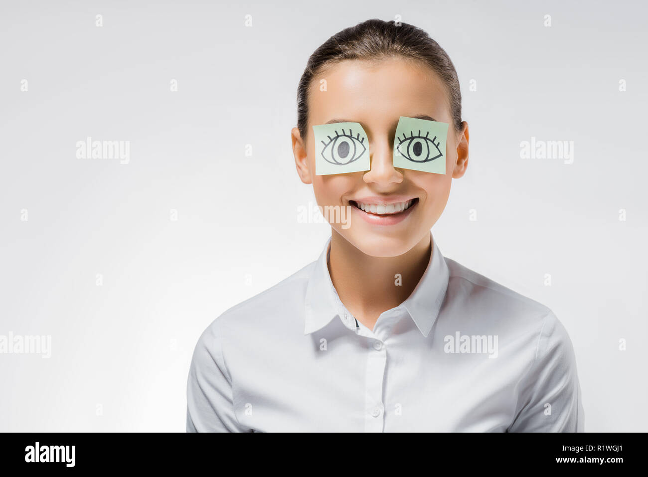 young smiling woman with sticky notes and drawn open eyes Stock Photo ...