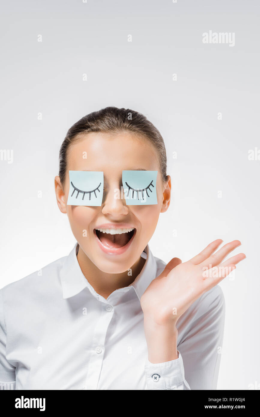 young smiling woman with sticky notes on eyes and drawn eyelashes Stock ...