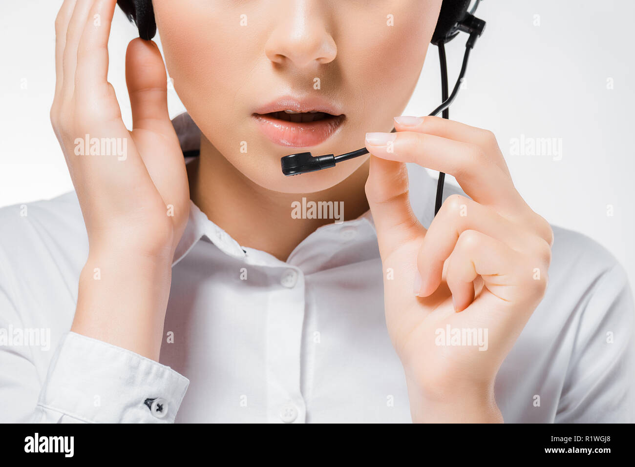 Young person speaking into microphone hi-res stock photography and ...