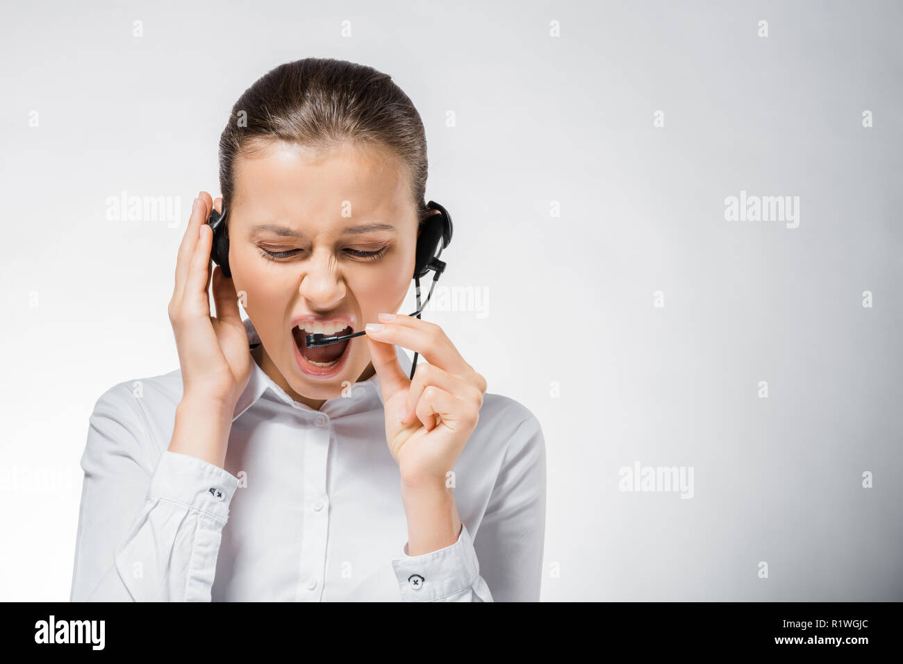 Woman headset angry hi-res stock photography and images - Alamy