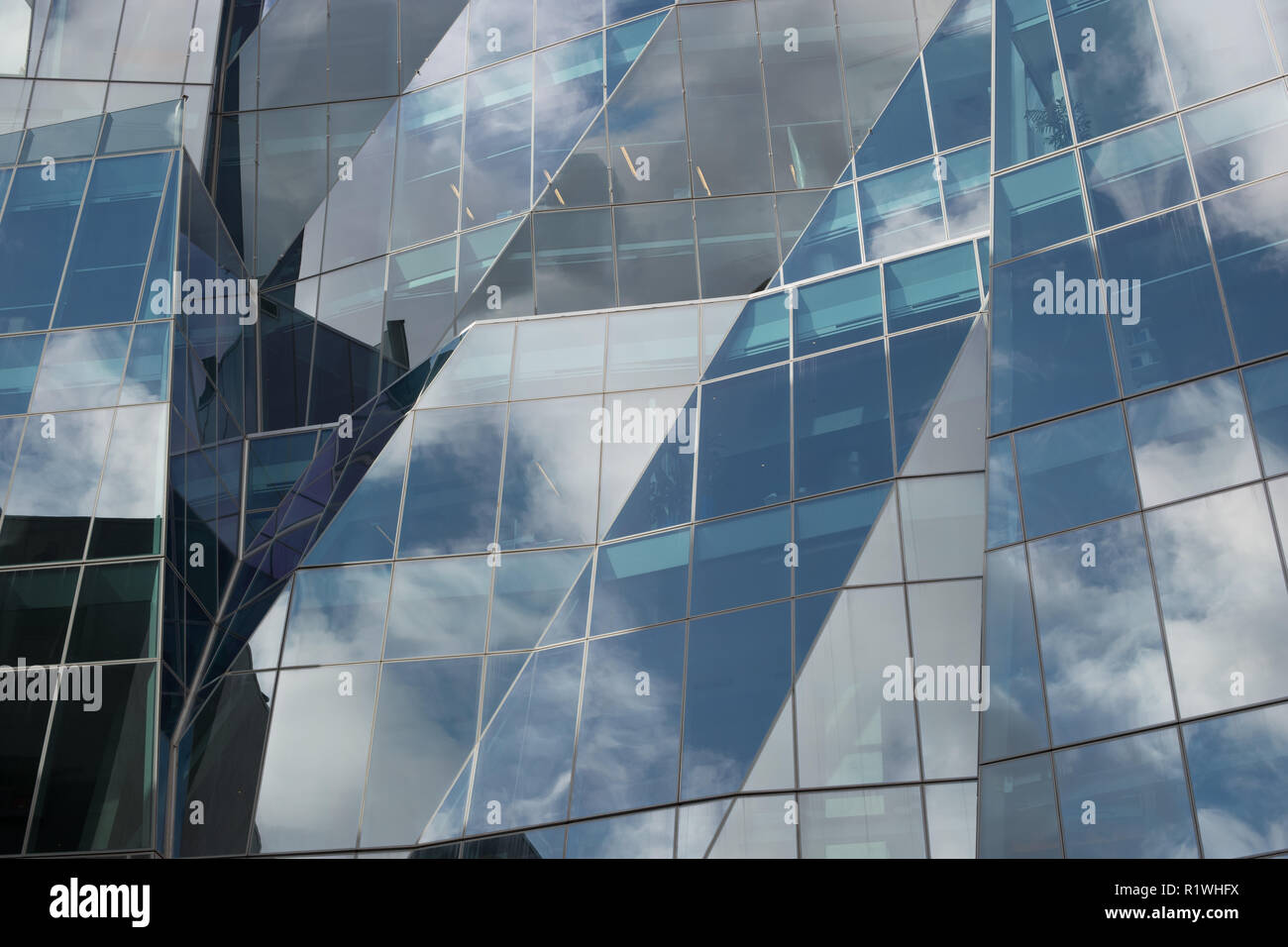 Windows and angles reflecting sky and clouds Stock Photo - Alamy