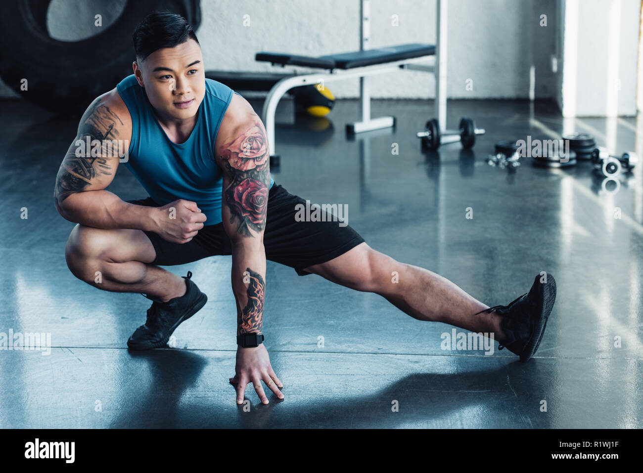 young sportsman doing squat exercise at gym Stock Photo - Alamy young sportsman doing squat exercise at gym Stock Photo - Alamy
