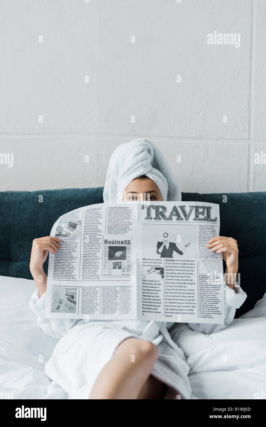 Hiding behind newspaper hi-res stock photography and images - Alamy