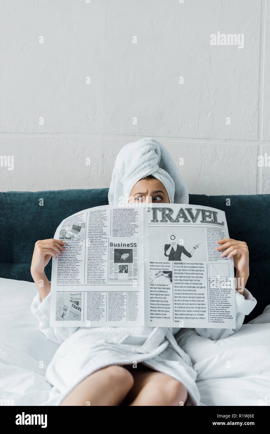 Hiding behind newspaper hi-res stock photography and images - Alamy