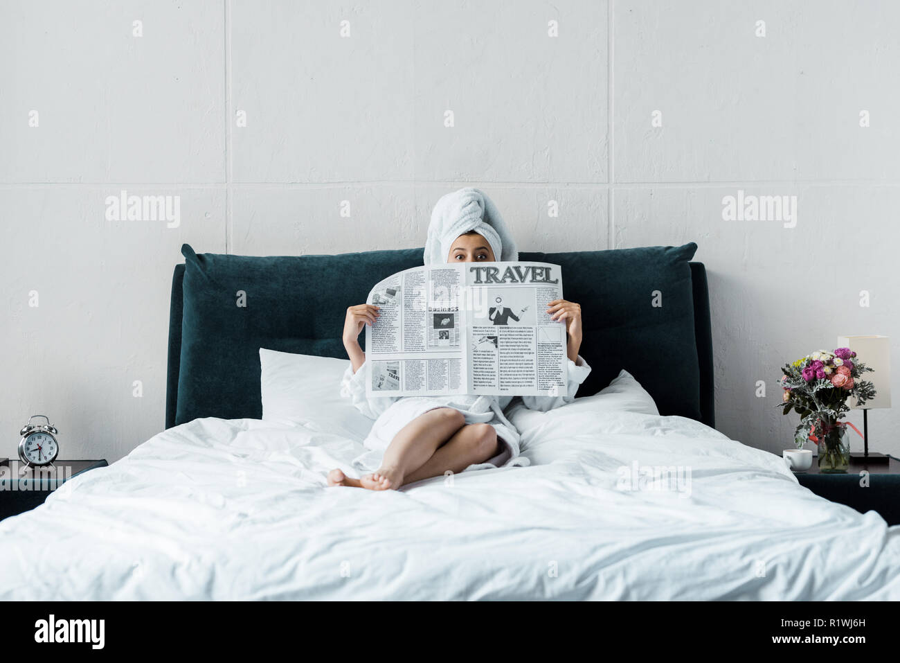 Hiding behind newspaper hi-res stock photography and images - Alamy