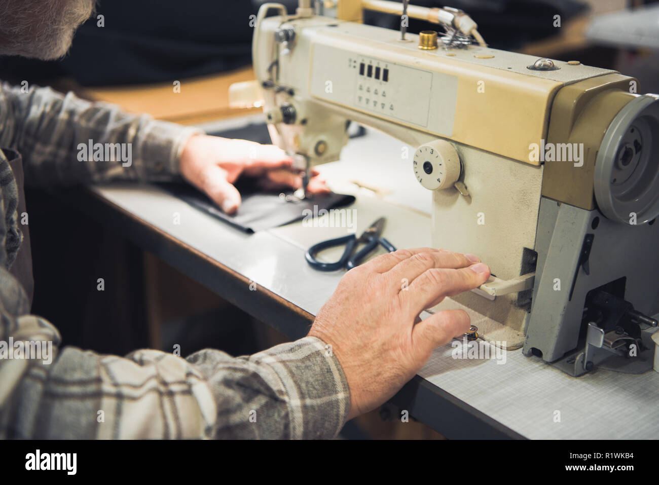 Male tailor working sewing machine hi-res stock photography and images ...